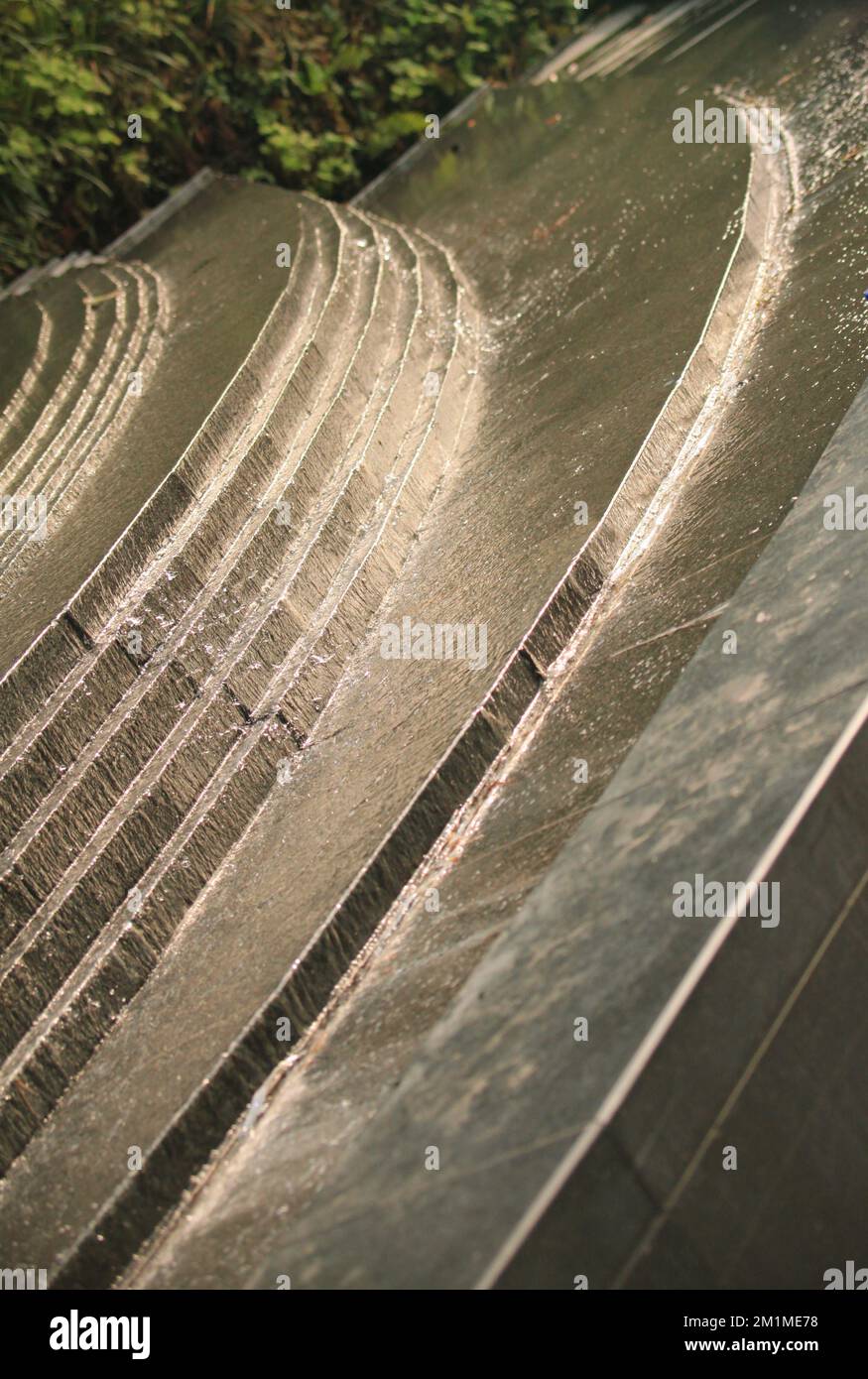 A vertical shot of stone stairs with flowing water. Park fountain Stock ...