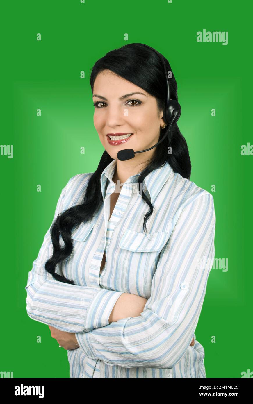 Beautiful woman operator working in a Call Center standing with hands ...
