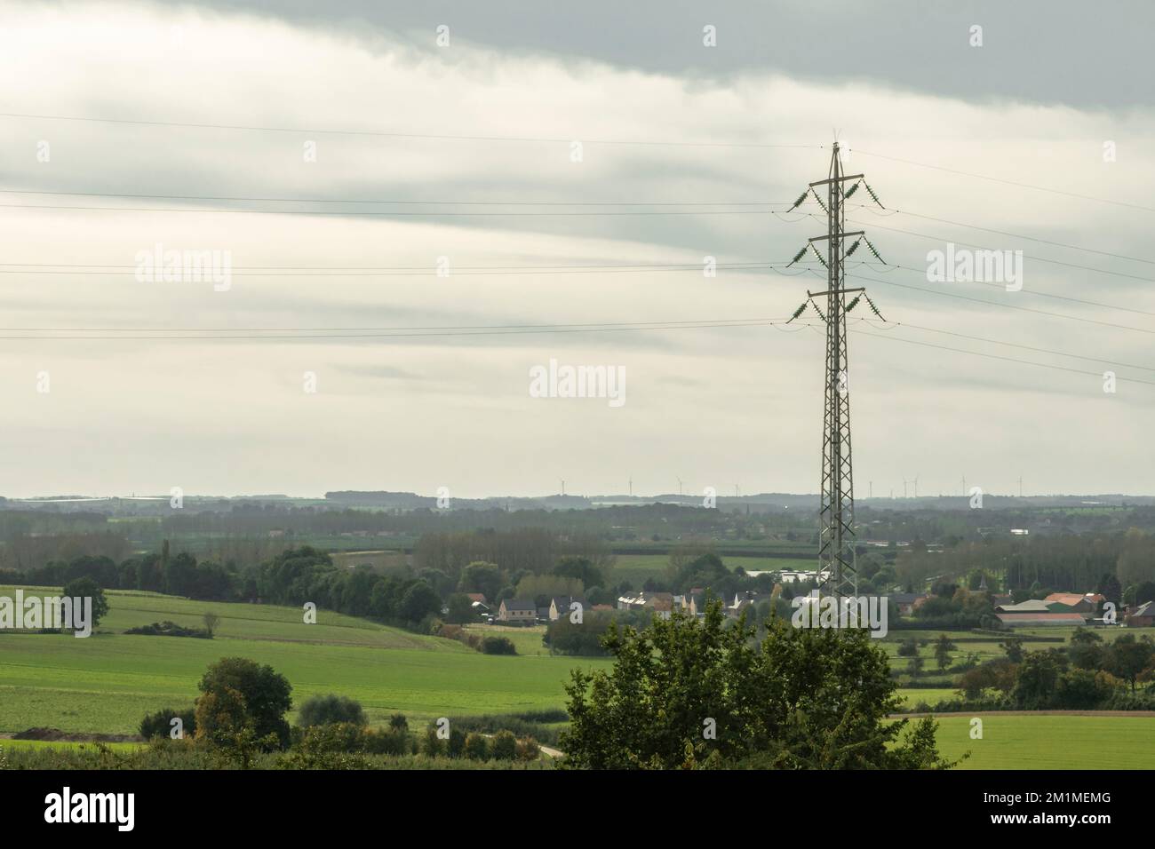 High-voltage power lines at countryside landscape of agricultural ...