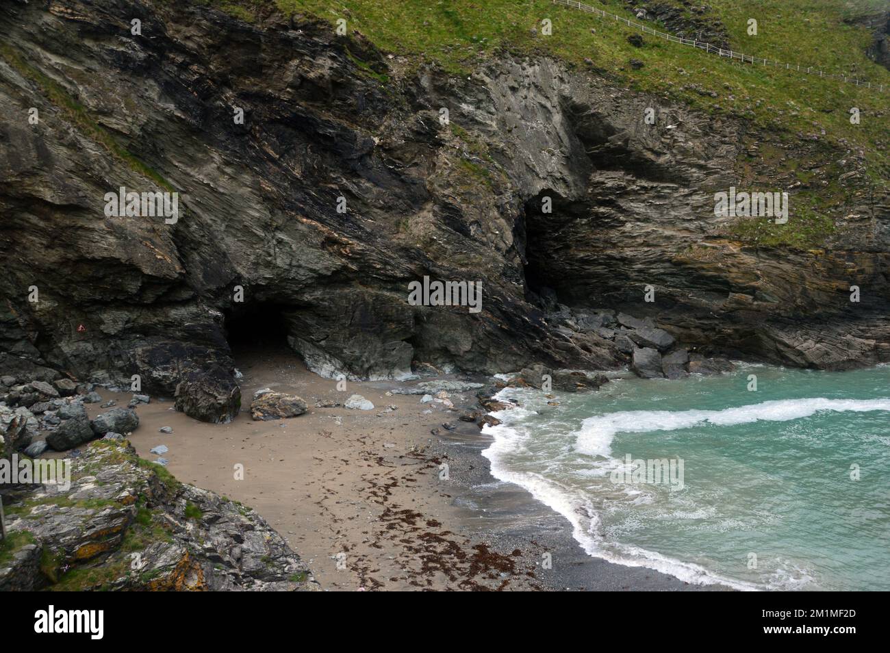 Merlin's Cave Below the Castle on Tintagel Island from Tintagel Haven ...