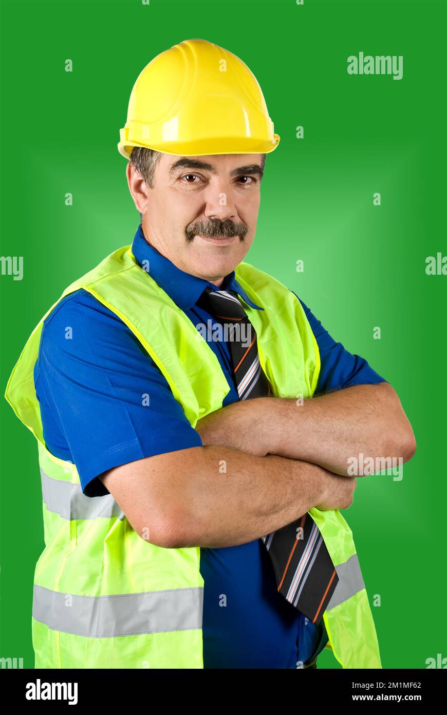 Engineer construction wearing a yellow helmet and protective vest ...