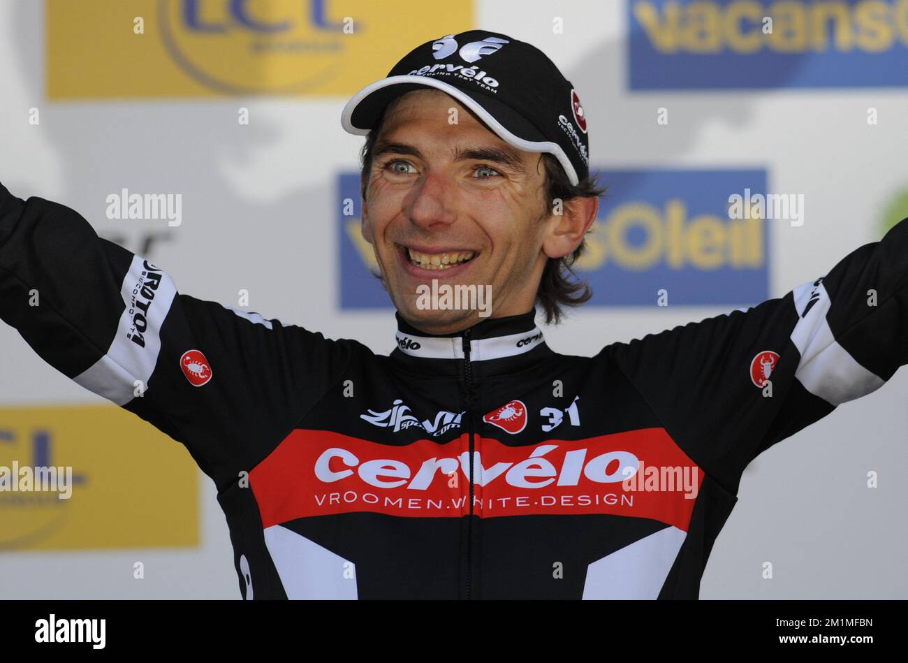 Spain's Xavier Tondo celebrates on the podium after winning stage six ...