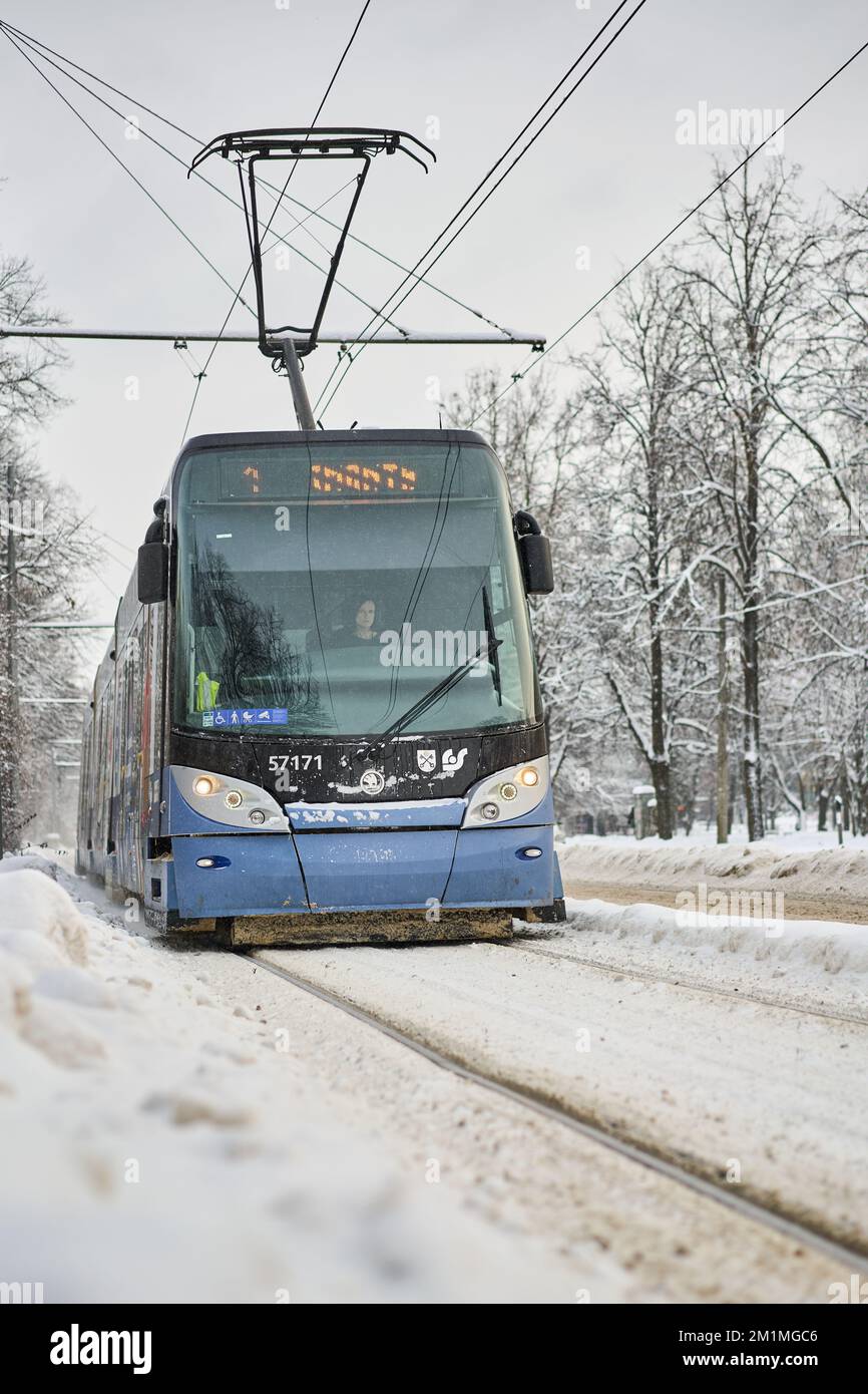 Riga, Latvia - December 13, 2022: Modern tram moving on the snowy ...