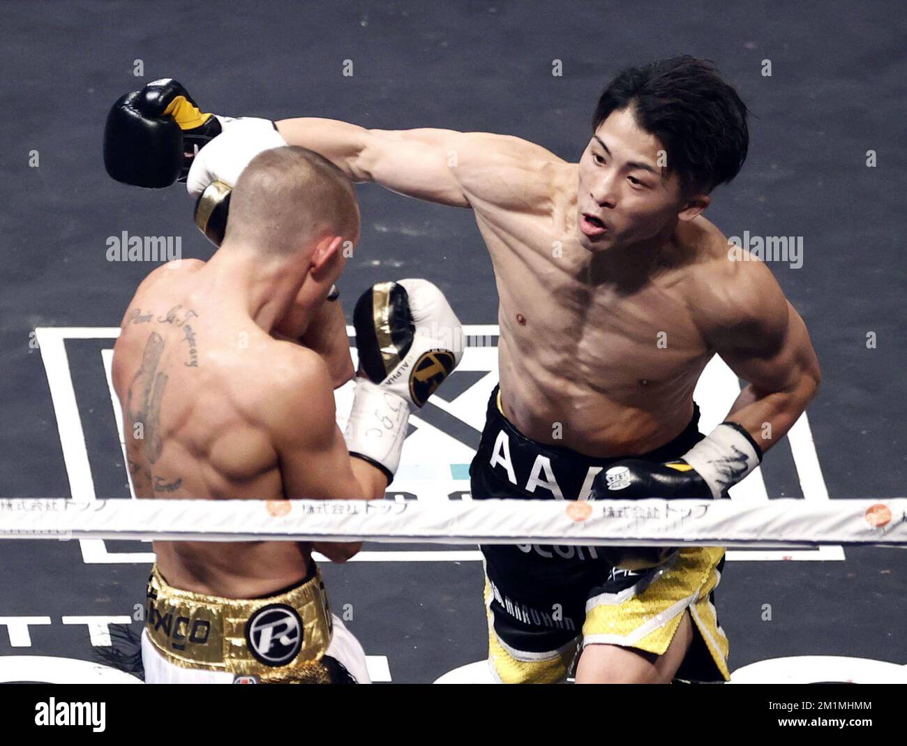 Tokyo, Japan, Dec. 13, 2022. WBA, WBC and IBF world boxing bantamweight champion Naoya Inoue (R ...
