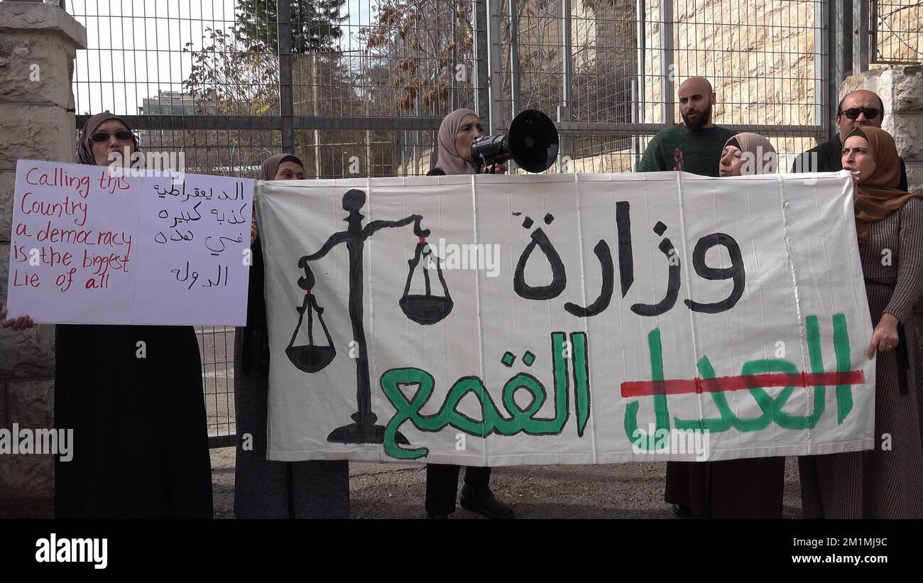 JERUSALEM, ISRAEL - DECEMBER 13: Palestinians hold signs as they take ...