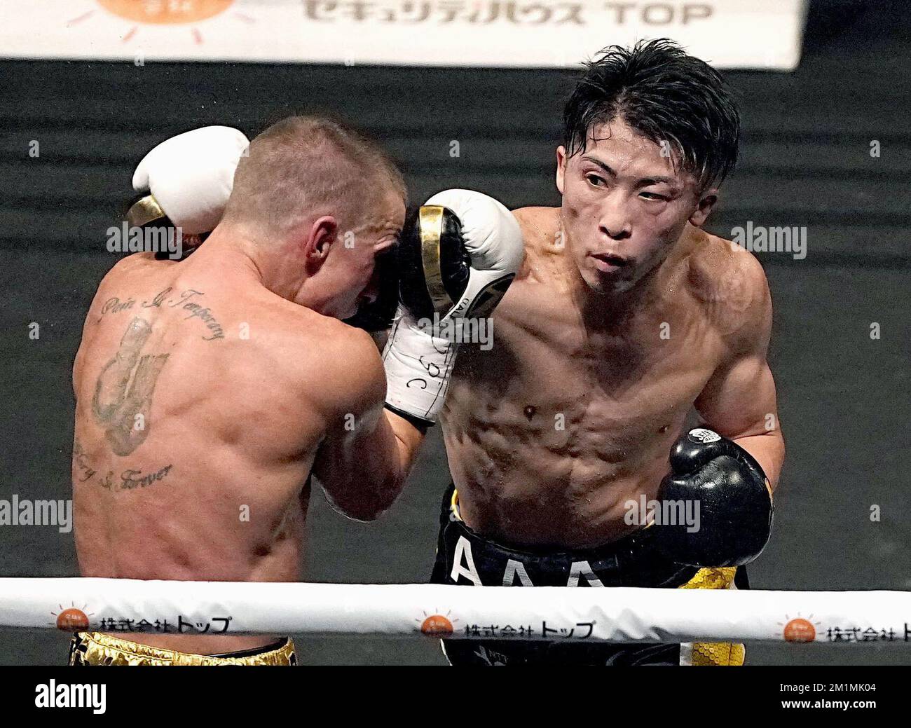Tokyo, Japan, Dec. 13, 2022. WBA, WBC and IBF world boxing bantamweight champion Naoya Inoue (R ...