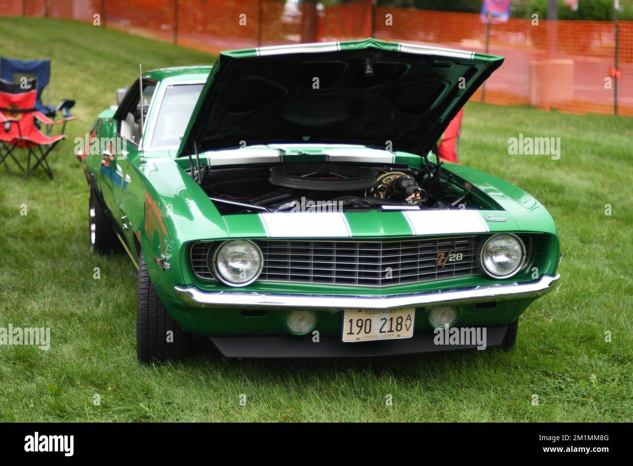An outdoor shot of a green Chevrolet Camaro with the hood opened at ...