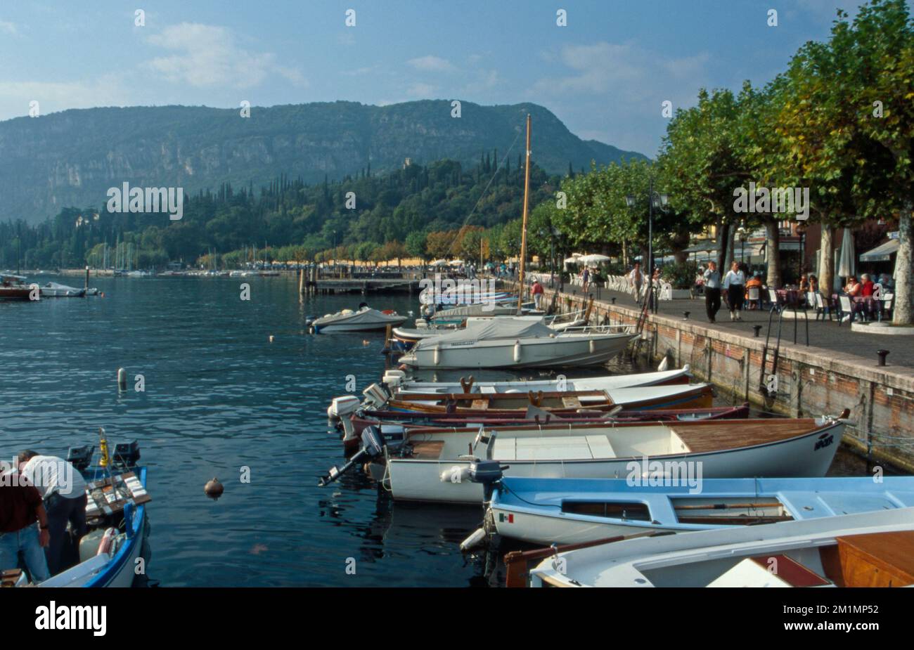 Boats and bars by the lakeside Sirmione Lombardy Italy Stock Photo - Alamy
