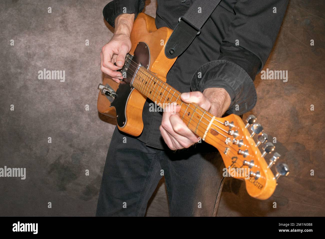 Vaduz, Liechtenstein, January 14, 2022 Artist is playing a Fender ...