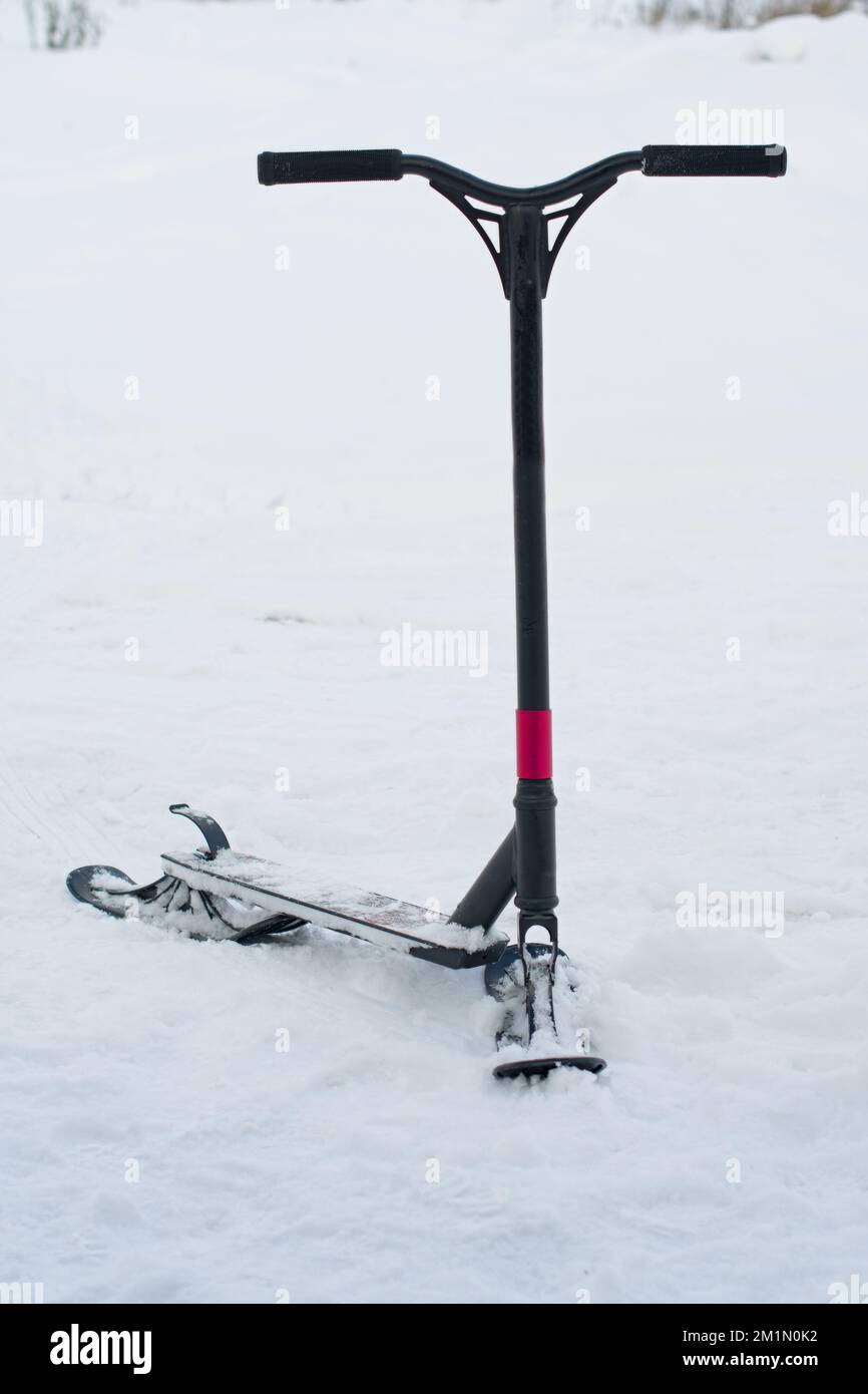 snow scooter in snow. A close up Stock Photo - Alamy