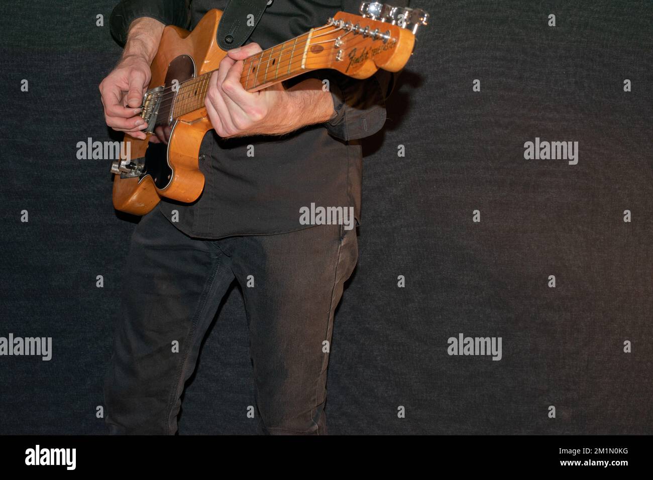 Vaduz, Liechtenstein, January 14, 2022 Artist is playing a Fender ...
