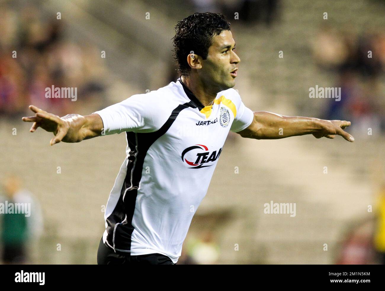 20120823 - BRUSSELS, BELGIUM: Lokeren's Hamdi Harbaoui celebrates after ...