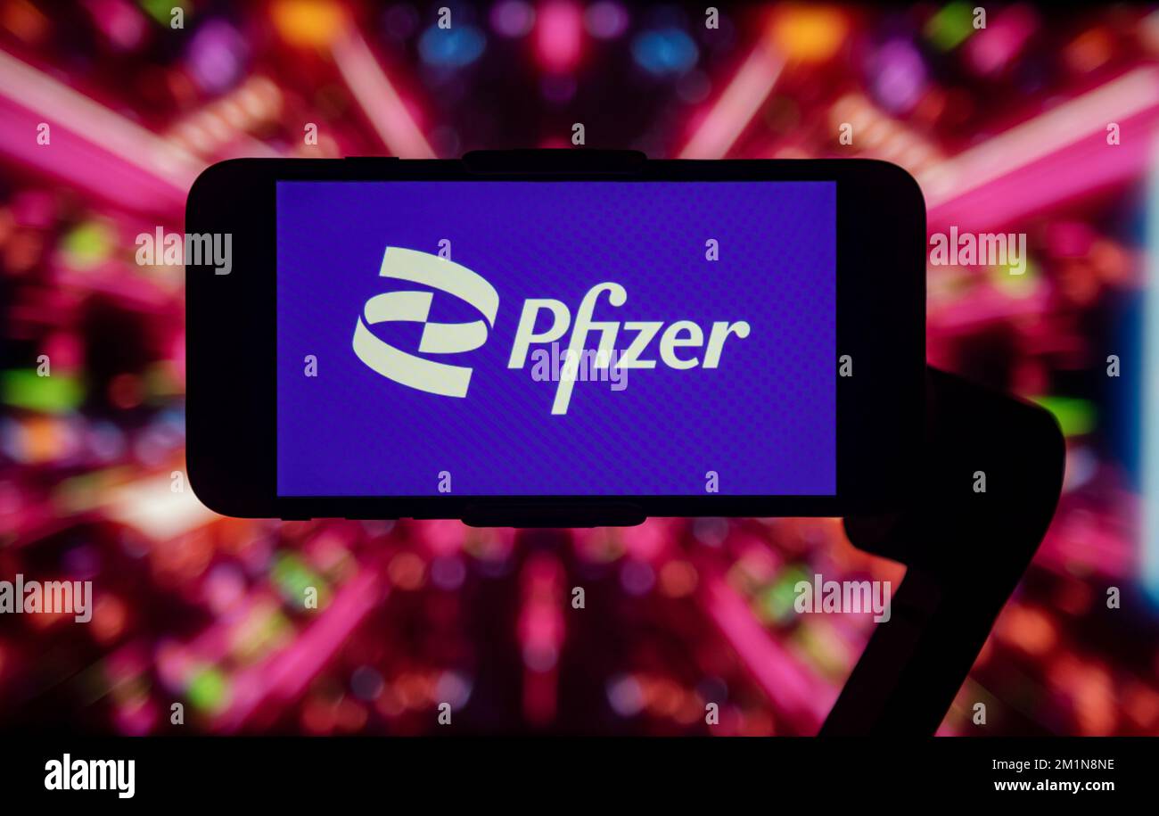In this photo illustration, the logo of Pfizer is seen displayed on a ...