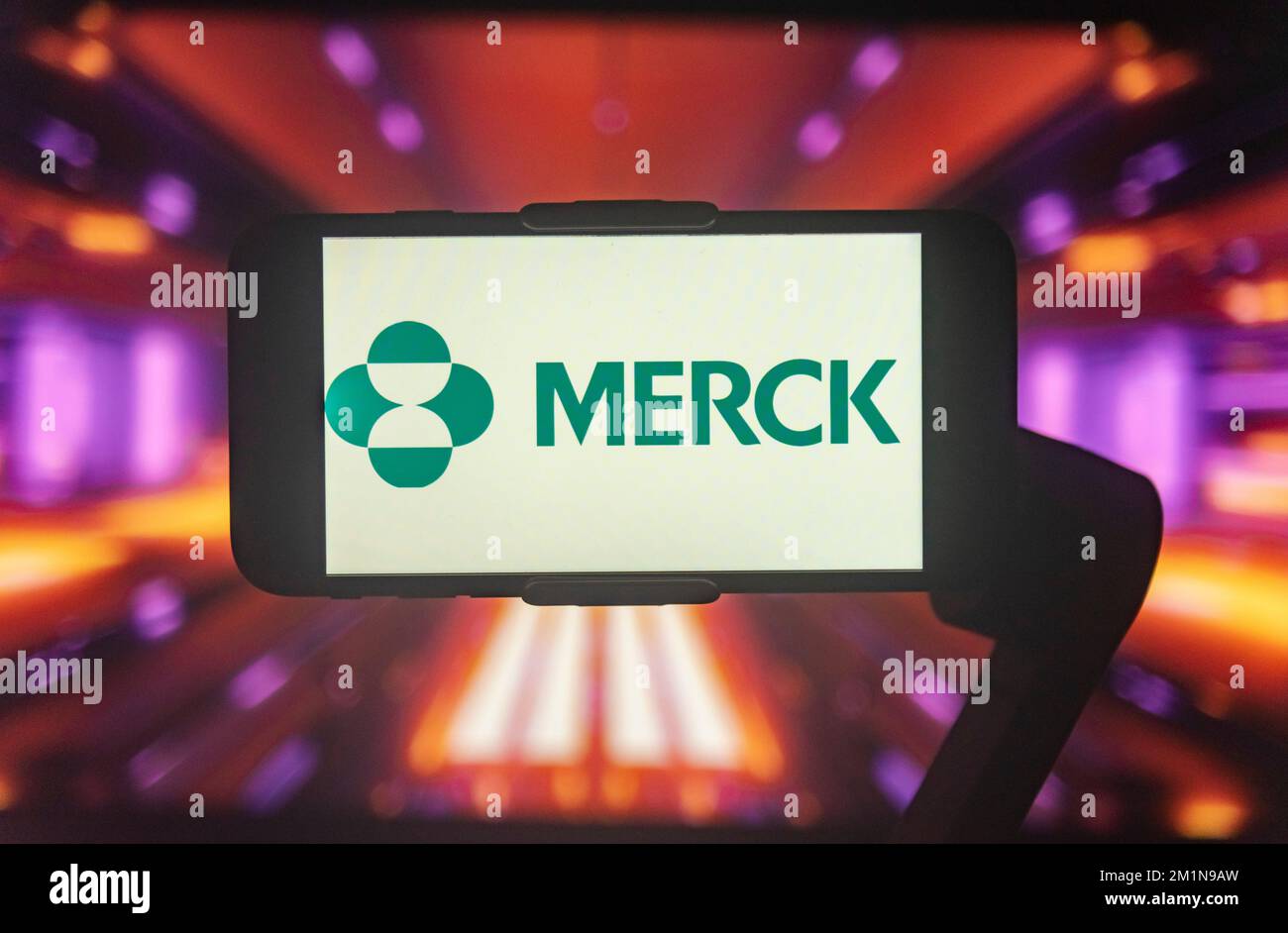 In this photo illustration, the logo of Merck is seen displayed on a ...