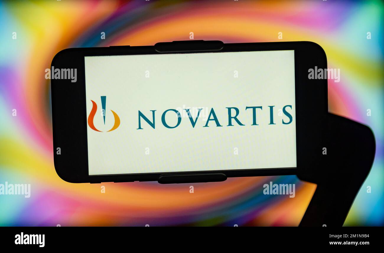 In this photo illustration, the logo of Novartis is seen displayed on a ...