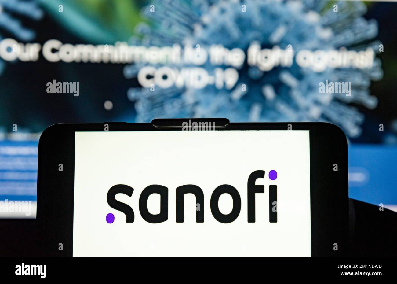 In this photo illustration, the logo of Sanofi is seen displayed on a ...