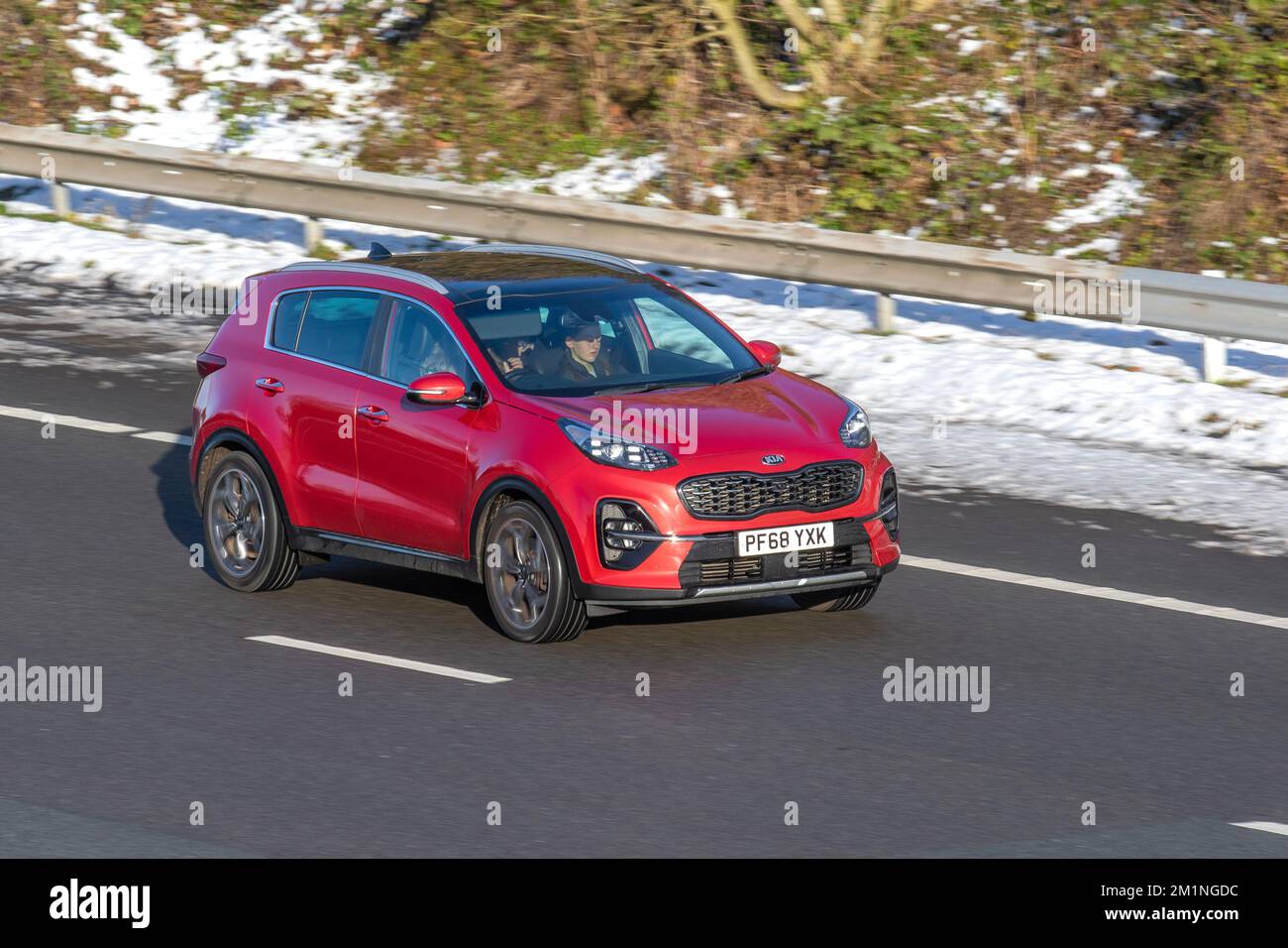 2018 Red KIA SPORTAGE 1598cc Diesel 7 speed; Cars travelling on a cold ...