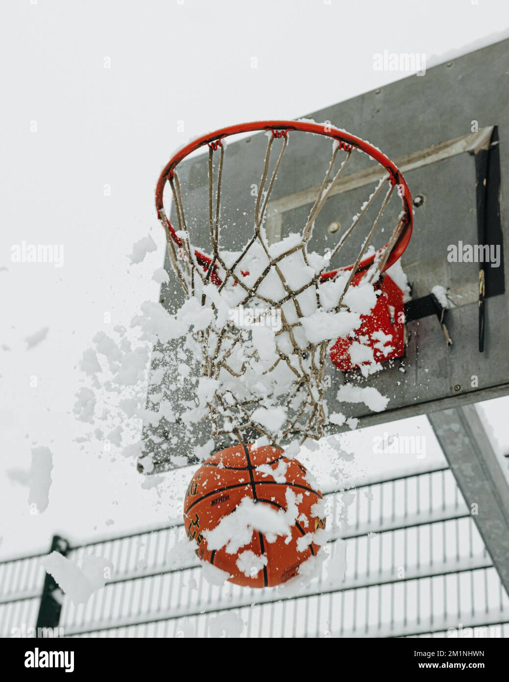 Views of snow on the outdoor basketball court in Clissold Park, Hackney ...