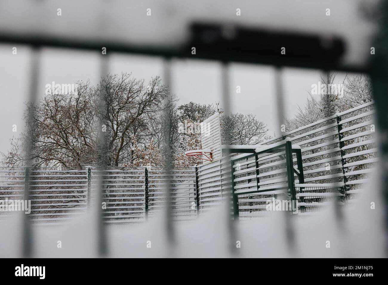 Views of snow on the outdoor basketball court in Clissold Park, Hackney ...