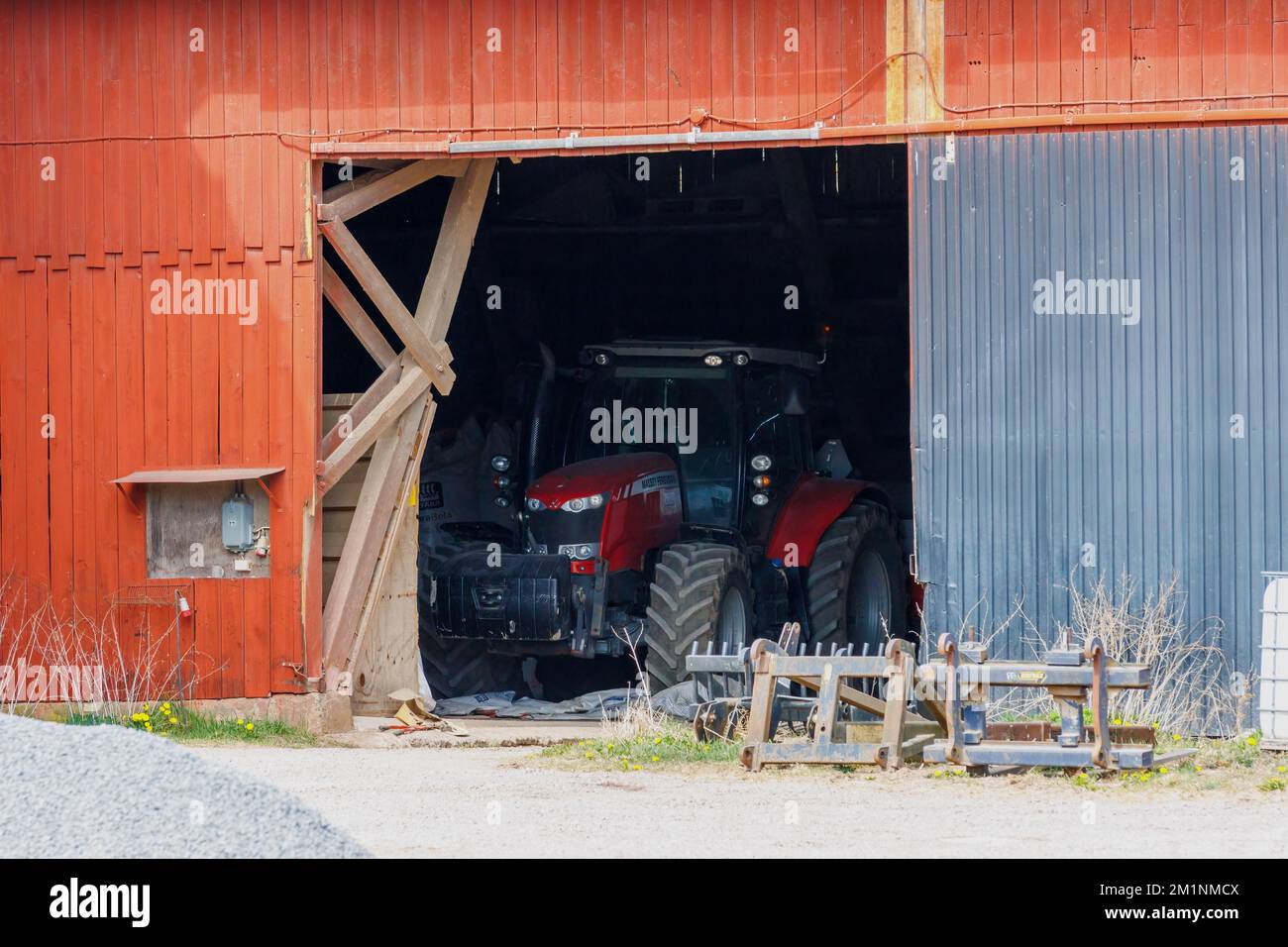 Motala Sweden May 2022 Farm Tractor in the barn garage waiting for work ...
