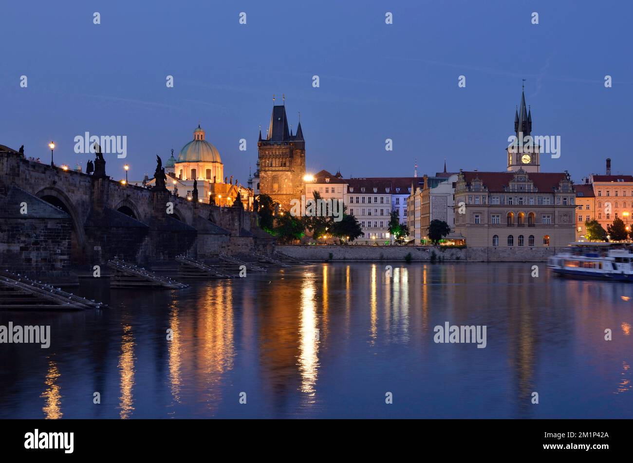 Historical Charles Bridge and towers of Old Town at dusk. View from the ...
