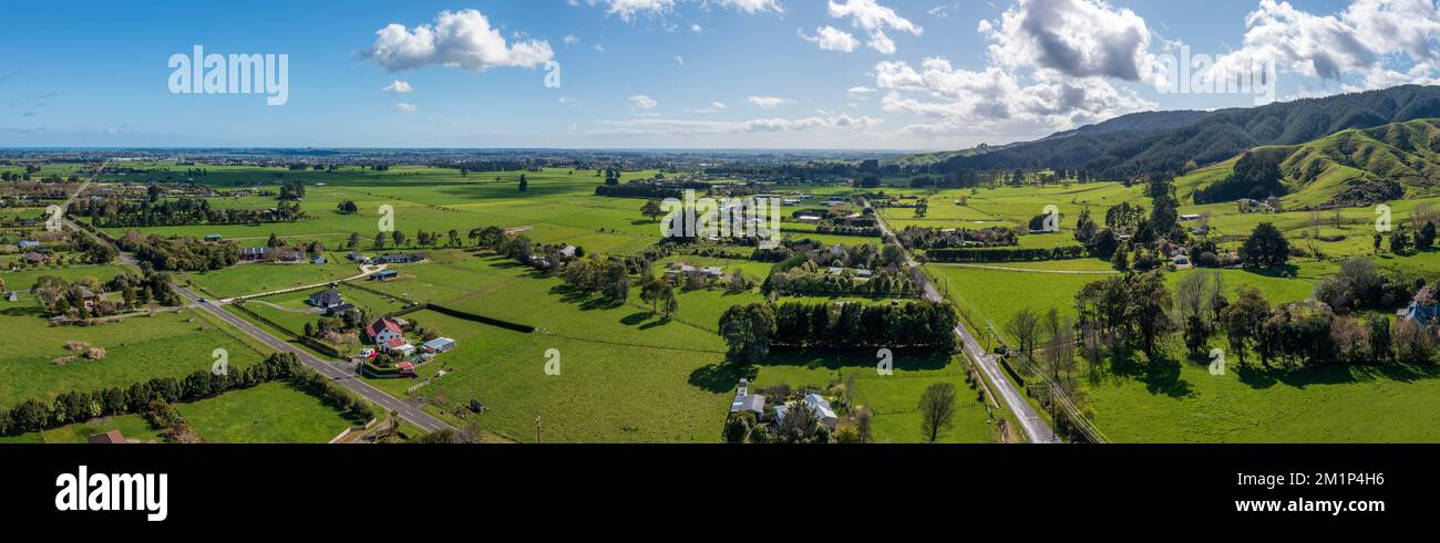 A panoramic shot of a rural agricultural landscape with fields and ...