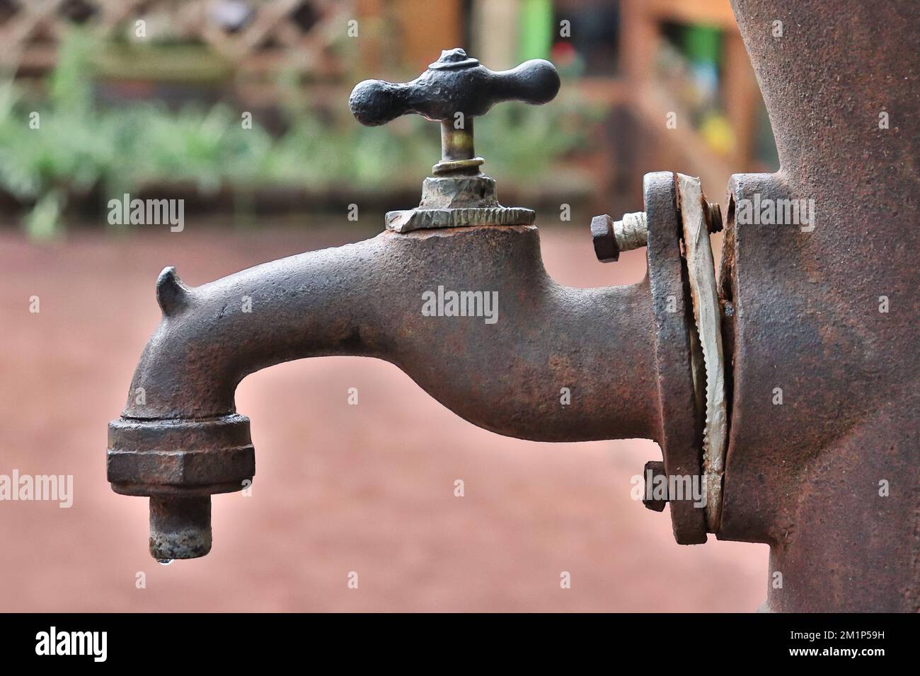 old rusty water tap bokeh Stock Photo - Alamy