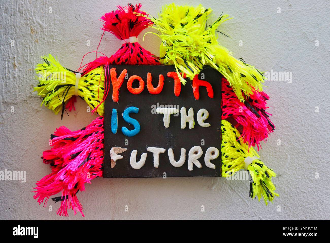 decorative woolen ornament with written legend Youth is the future ...