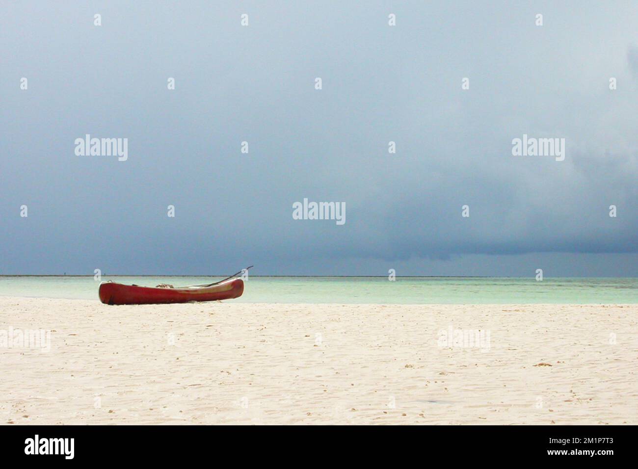 Tropical seascape with traditional canoe Stock Photo - Alamy