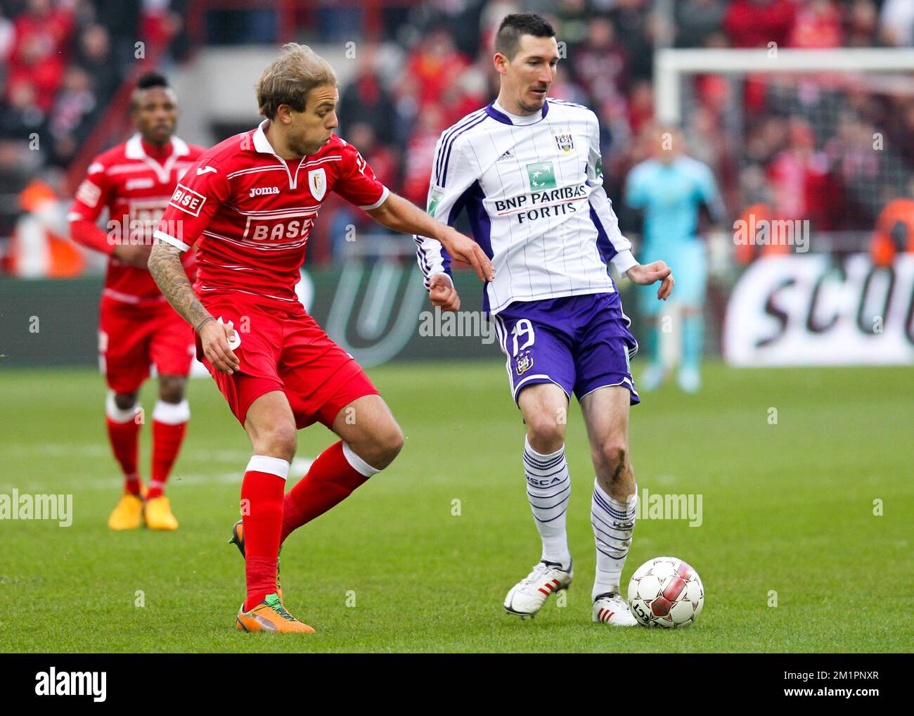 Standard's Yoni Buyens and Anderlecht's Sacha Kljestan fight for the ...