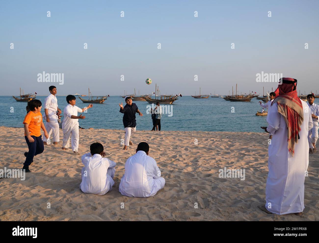 Children play ball games on the beach at Katara Cultural Village in ...