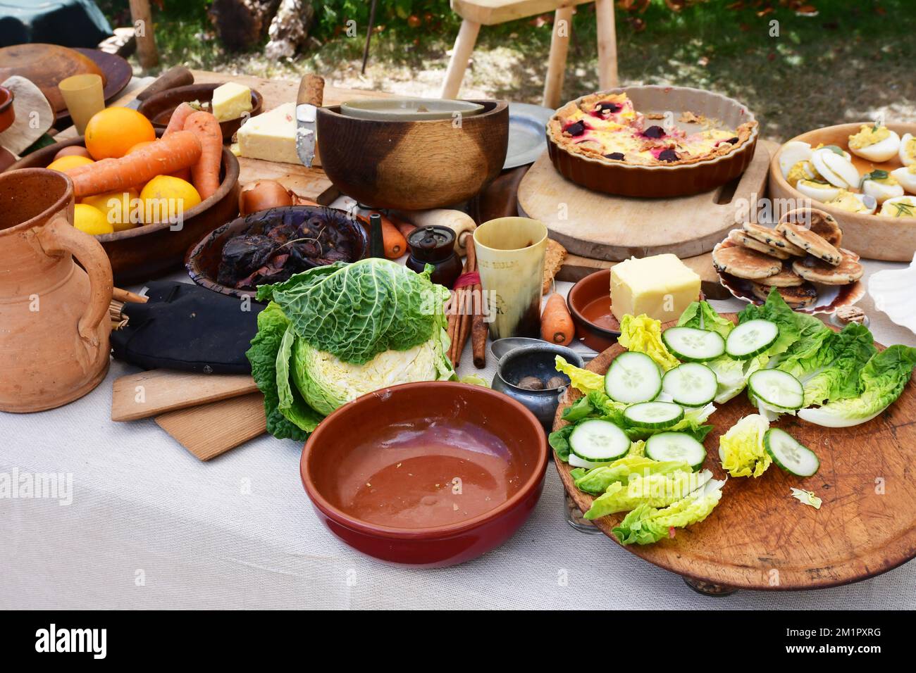 Table of vegetables and traditional food at a Medieval re-enactment ...