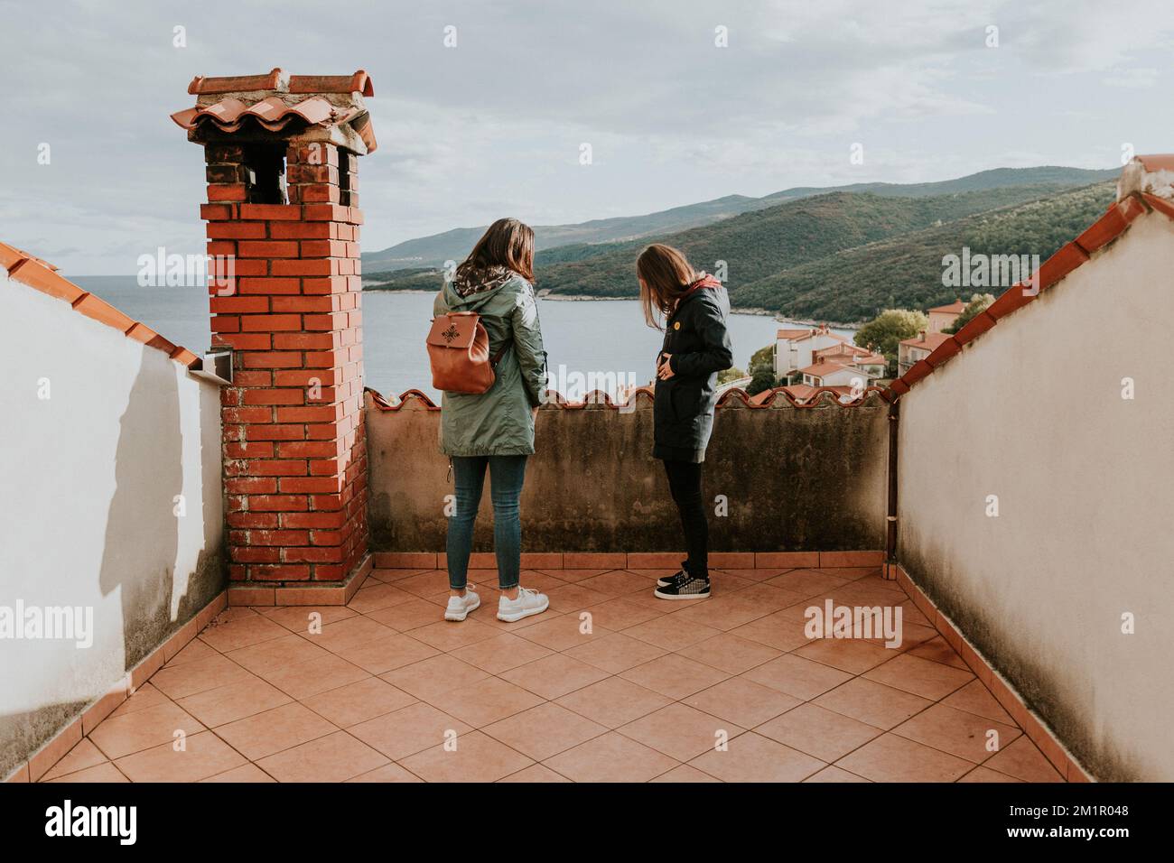 Girls on the rooftop Stock Photo - Alamy