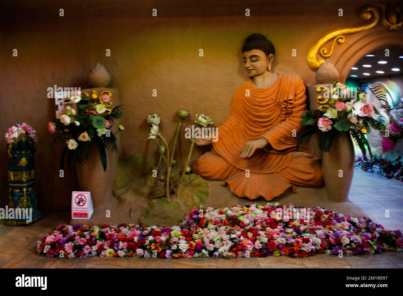 Carving sculpture buddha and deity angel on earth wall for thai people ...