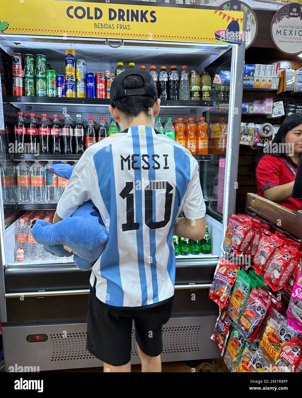 Mexico City, Mexico, USA. 12th Dec, 2022. A fan of Argentine soccer star LIONEL MESSI shops at ...