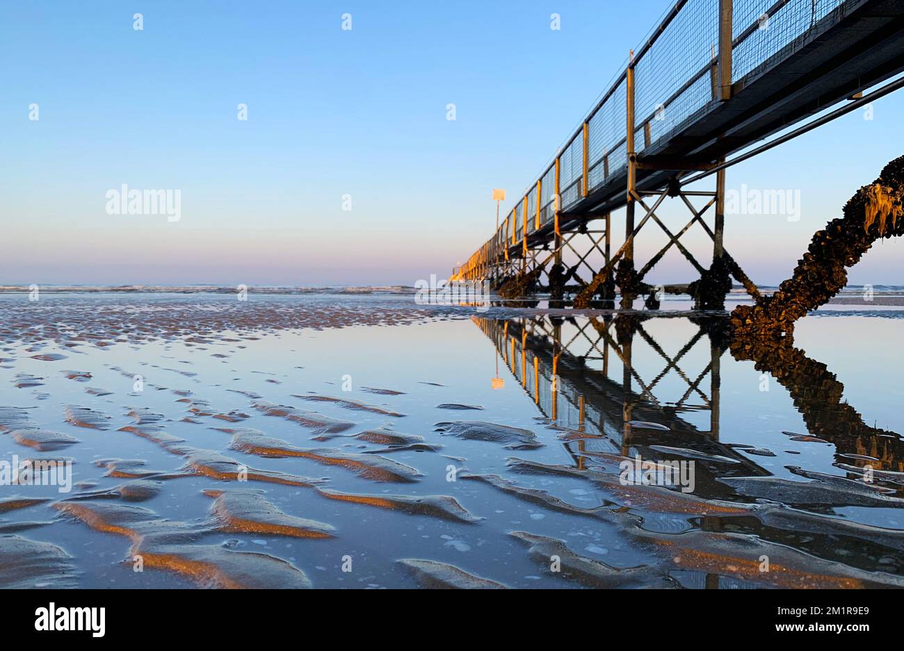 Marine landscape with pier for mooring small boats Stock Photo - Alamy