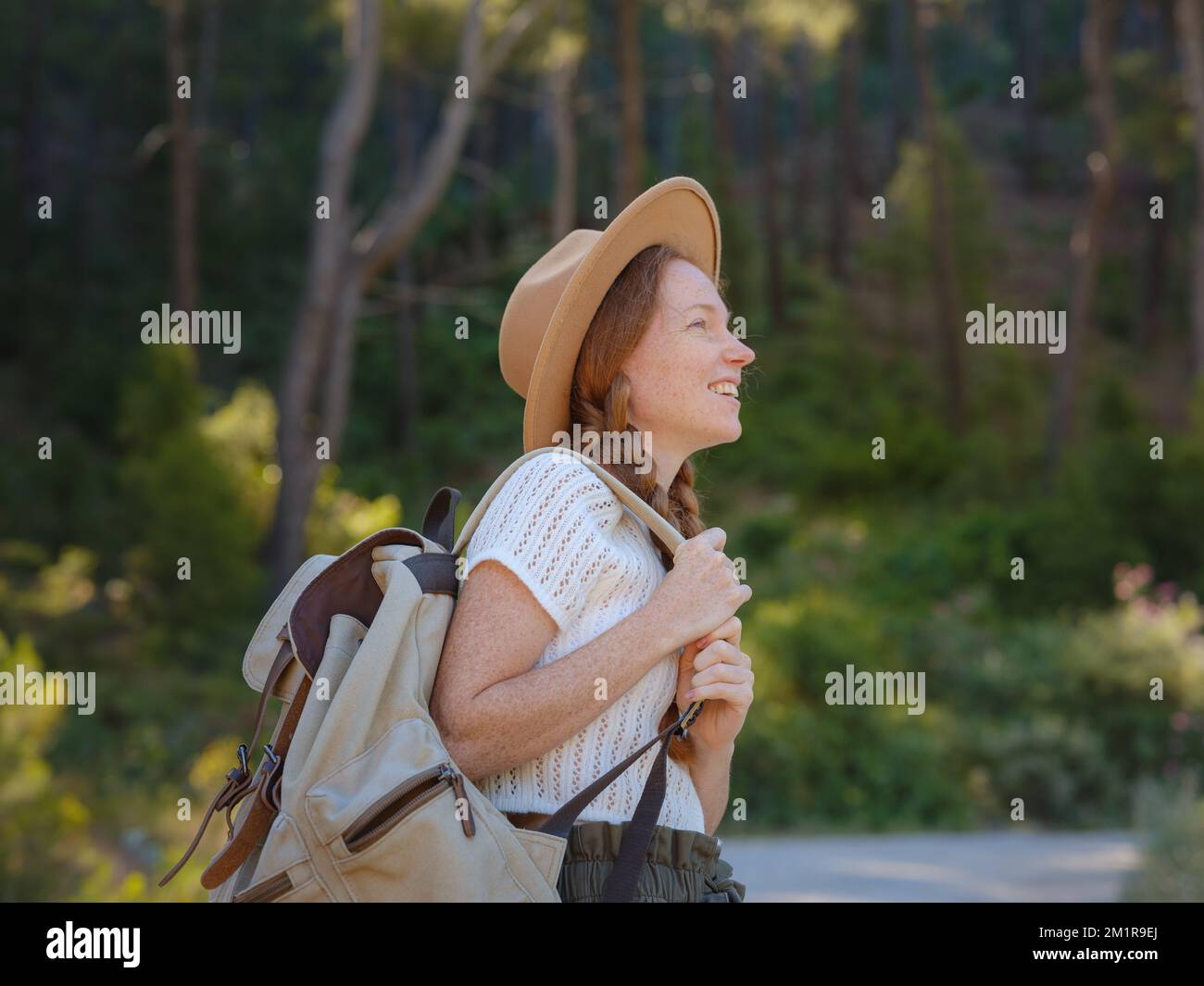 Caucasian ginger young beautiful female backpacker traveling alone in ...