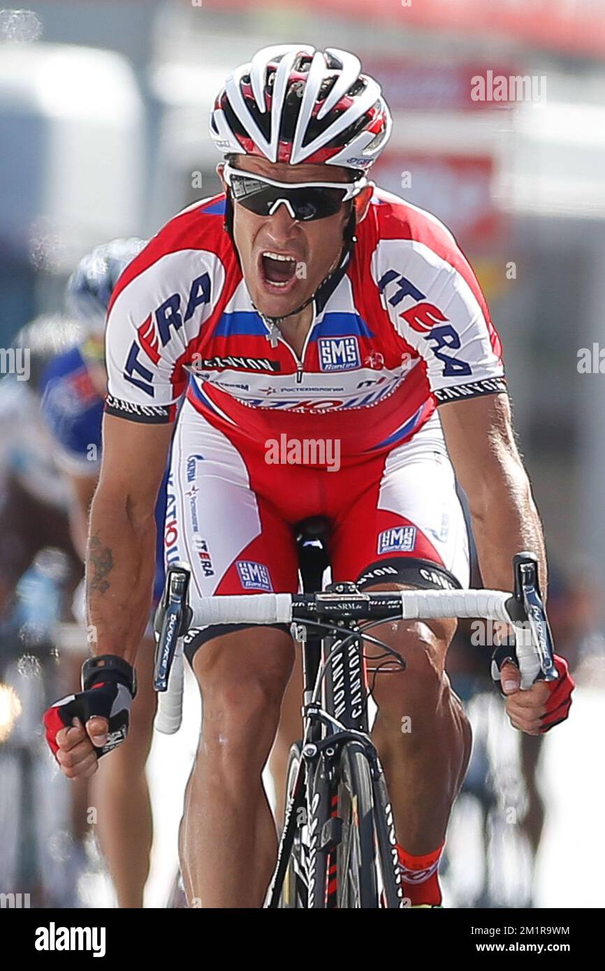 Russian Alexander Kolobnev of Team Katusha celebrates as he crosses the ... Russian Alexander Kolobnev of Team Katusha celebrates as he crosses the ...