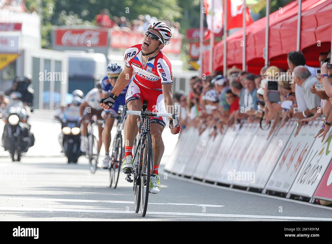 Russian Alexander Kolobnev of Team Katusha celebrates as he crosses the ... Russian Alexander Kolobnev of Team Katusha celebrates as he crosses the ...
