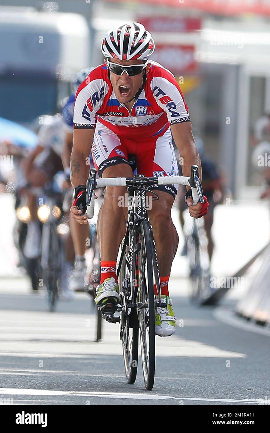 Russian Alexander Kolobnev of Team Katusha celebrates as he crosses the ... Russian Alexander Kolobnev of Team Katusha celebrates as he crosses the ...