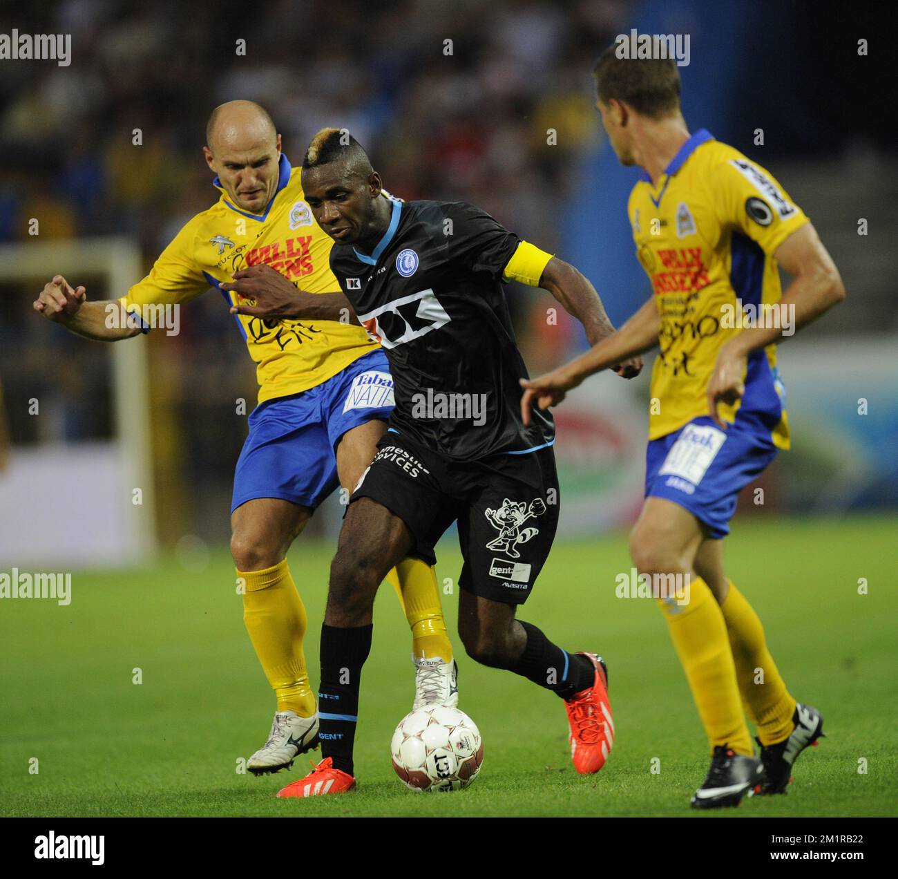 Waasland-Beveren's Milos Maric (L) and Gent's Petit-Pele Mboyo fight ...