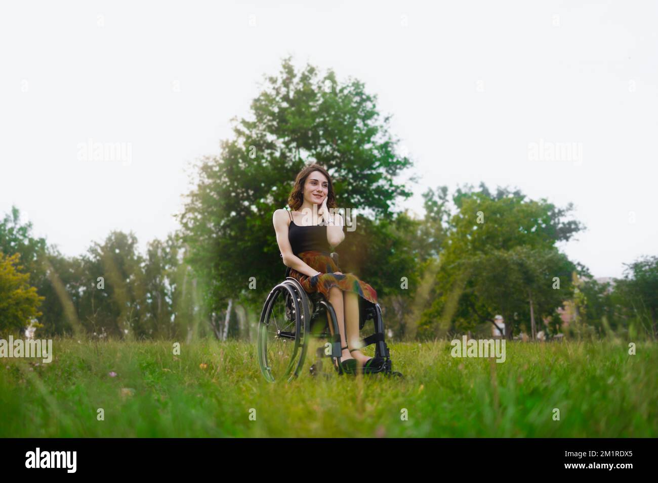 Young woman with paraplegia smiling Stock Photo - Alamy