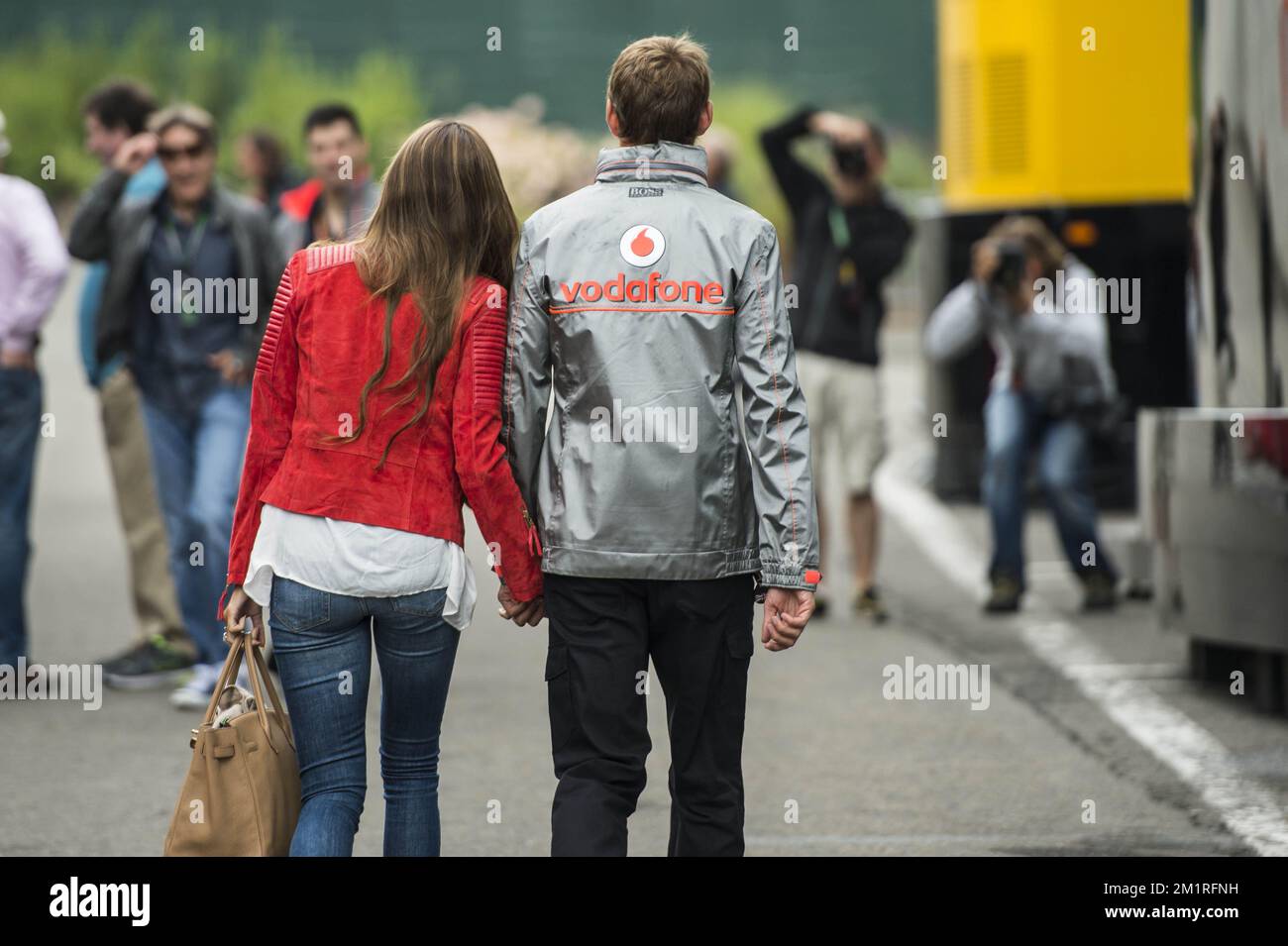 British Jenson Button of McLaren (R) and his girlfriend Jessica ...