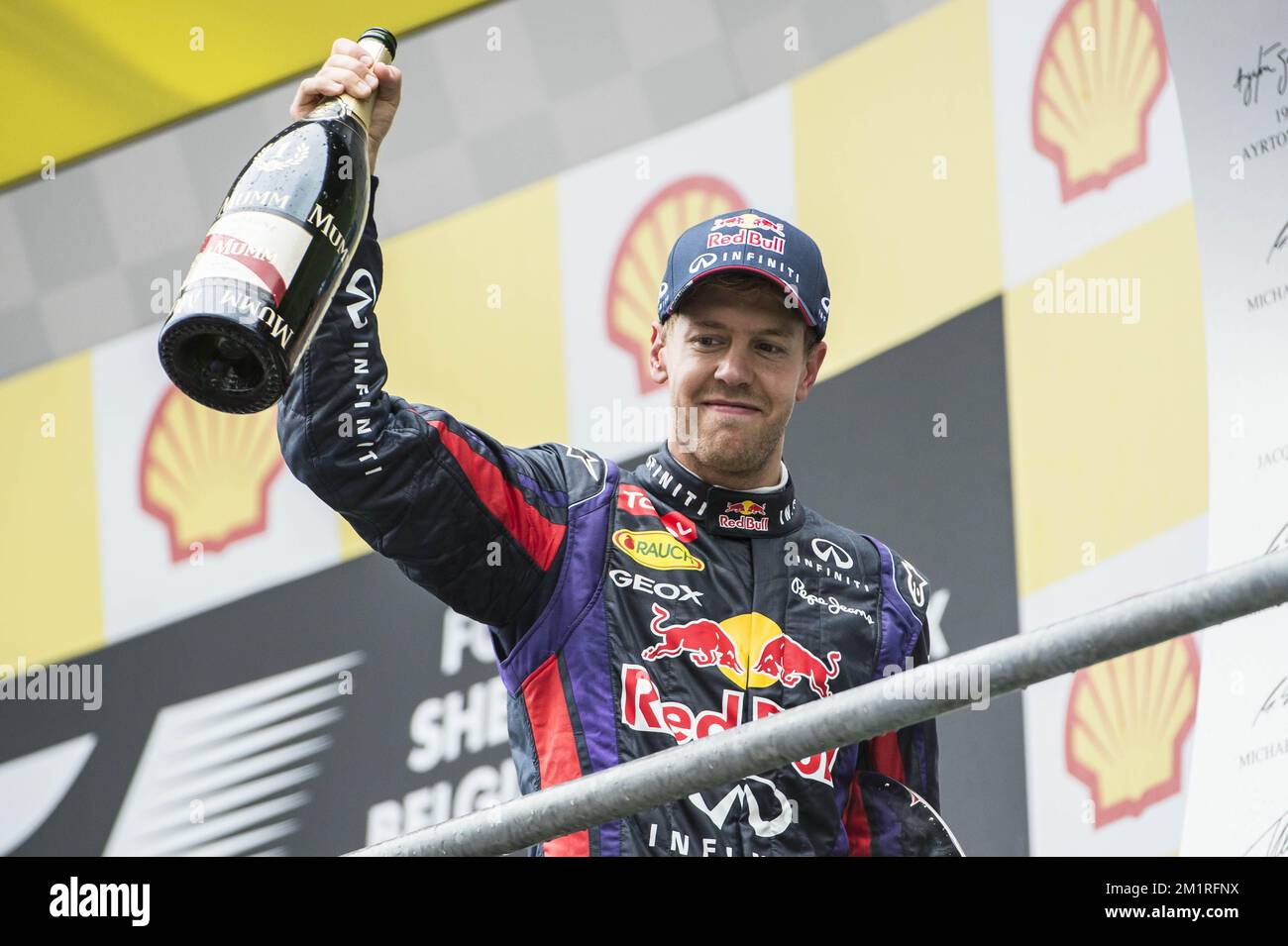 German Sebastian Vettel of Red Bull Racing celebrates on the podium ...