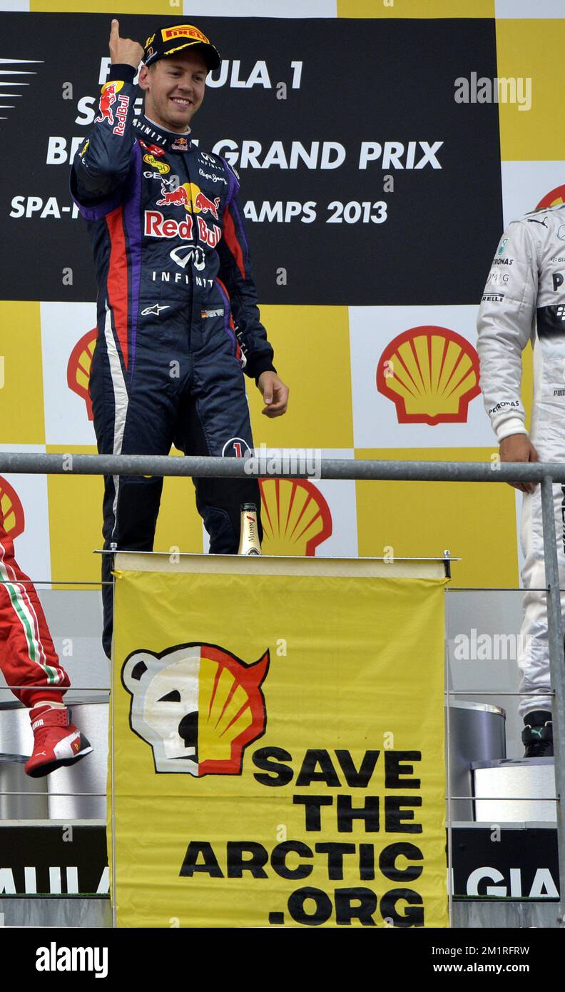 German Sebastian Vettel of Red Bull Racing celebrates on the podium ...