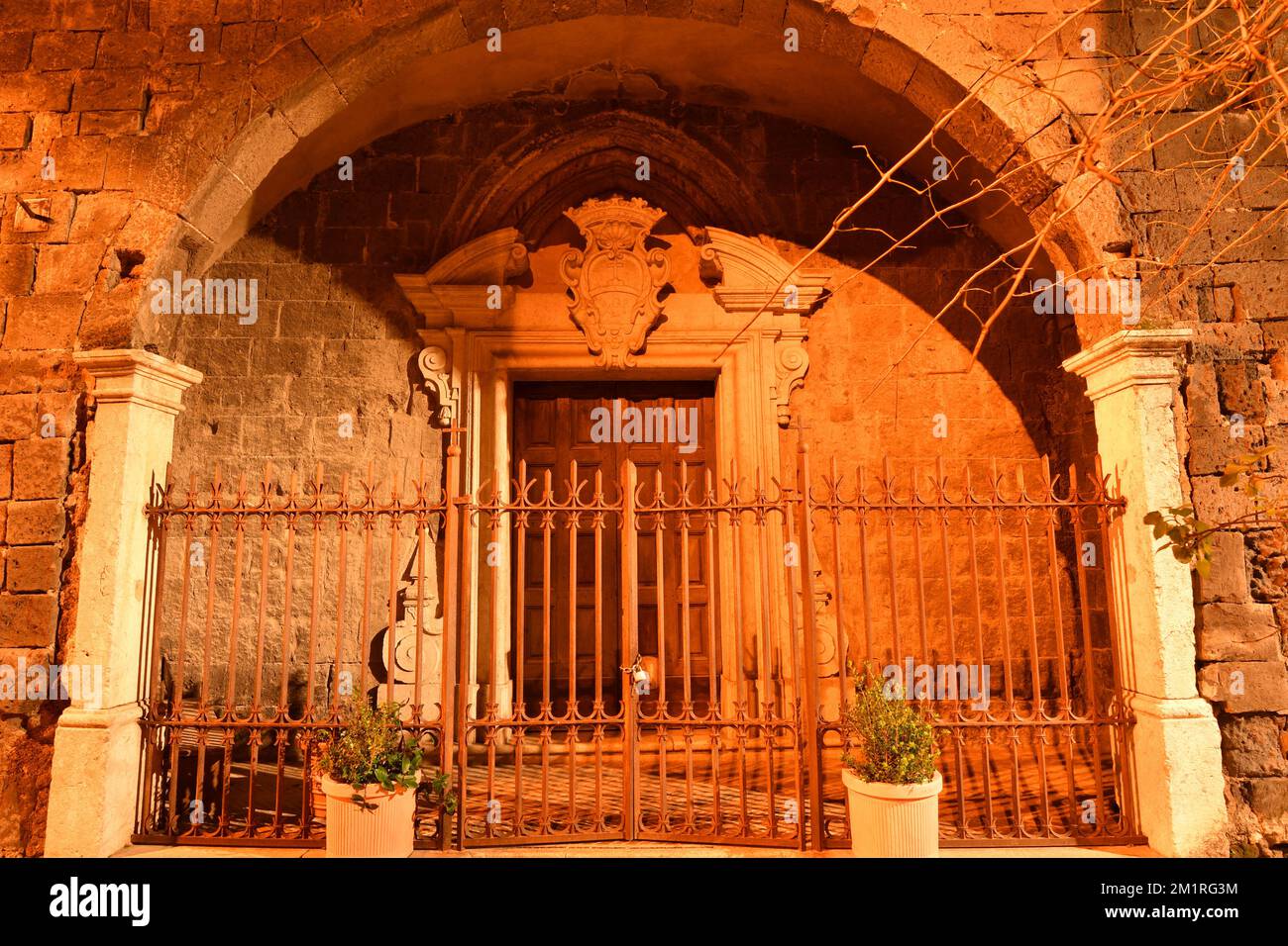 The facade of an ancient church in the medieval quarter of the city.of ...