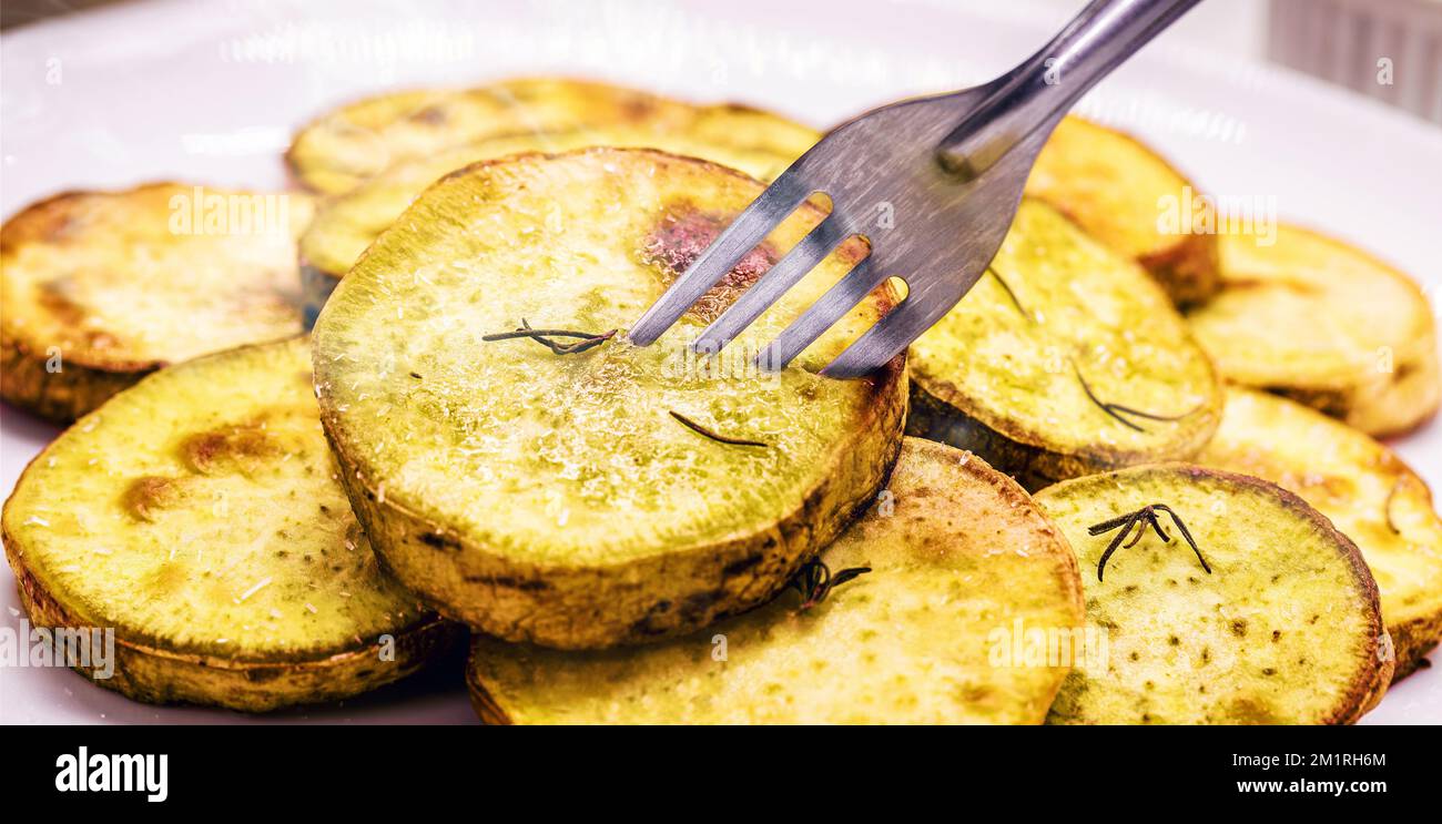 fried or baked sweet potatoes, sliced and served hot, typical food from ...