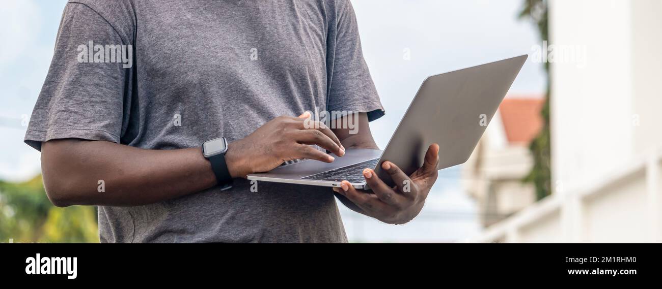 Black African hand holding and using blank screen mobile phone ...