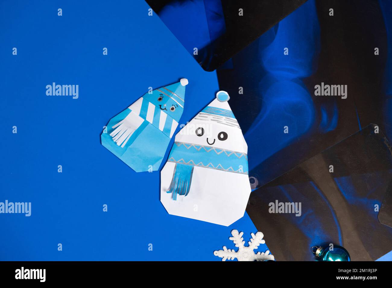 Christmas radiology - X-rays, snowmen and snowflakes on a blue ...