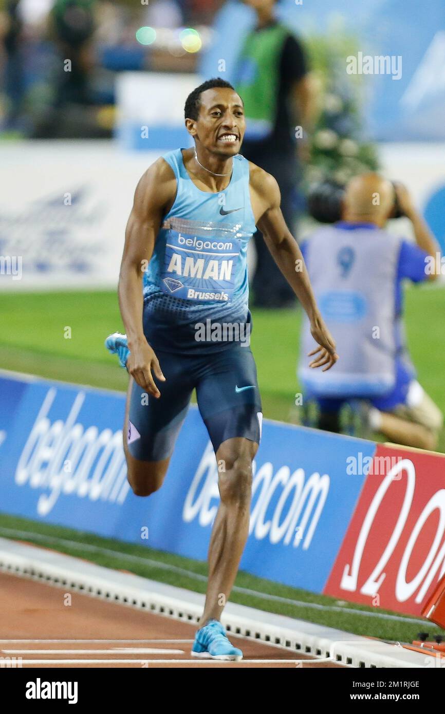 Ethiopia's Mohammed Aman celebrates as he crosses the finish line to ...